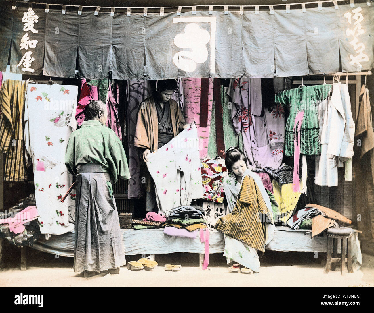 [ 1890s Japan - Japanese Kimono Shop ] — Two men and a woman at a ...
