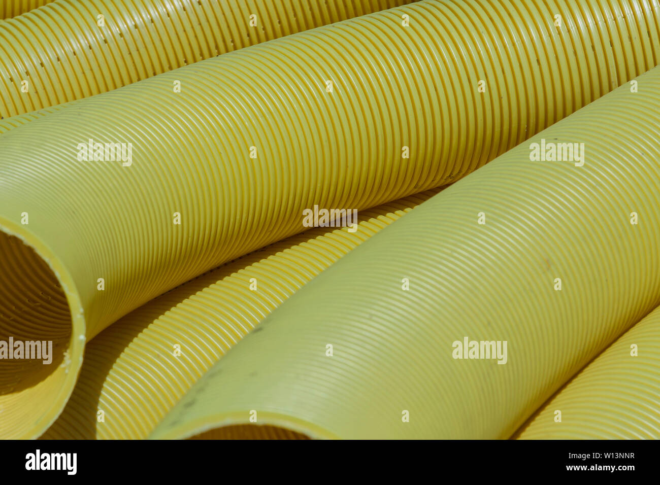 Yellow drain pipe - construction site Stock Photo - Alamy
