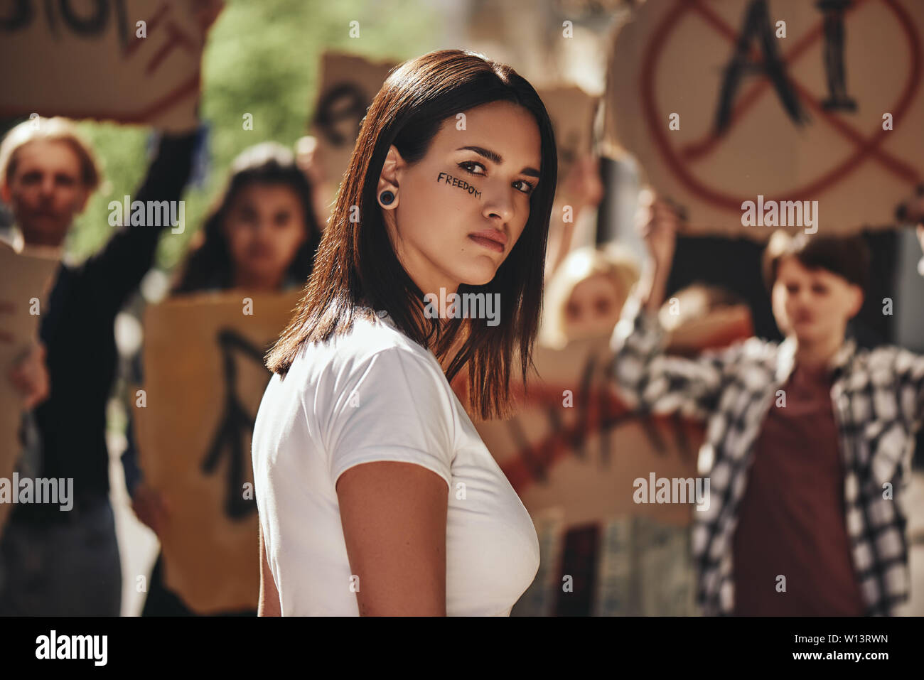 Fighting for my rights. Young activist with word freedom written on her ...