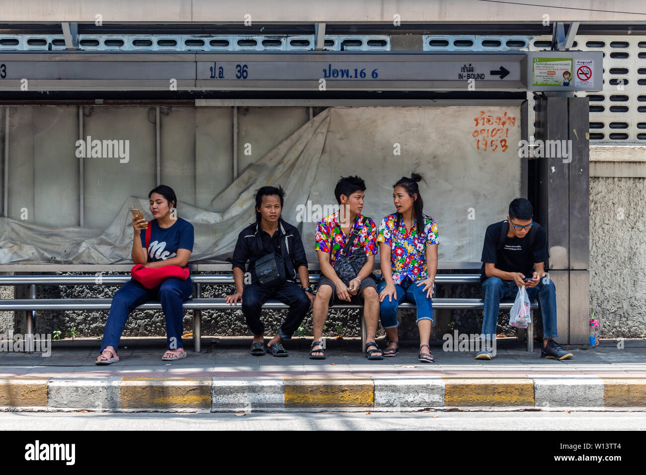 Crowd bus stop people standing hi-res stock photography and images - Alamy