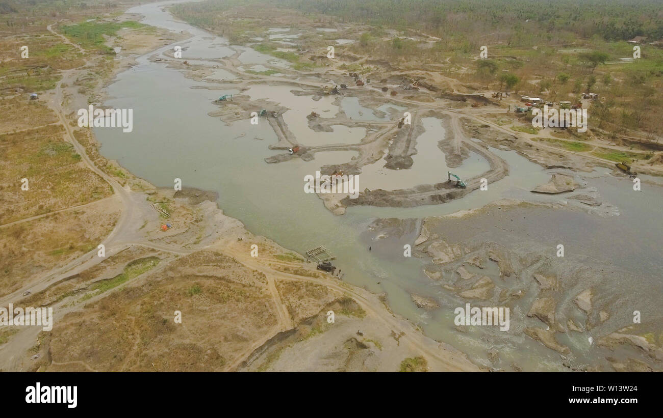 Aerial view excavator and heavy equipment, dredging and deepening the ...