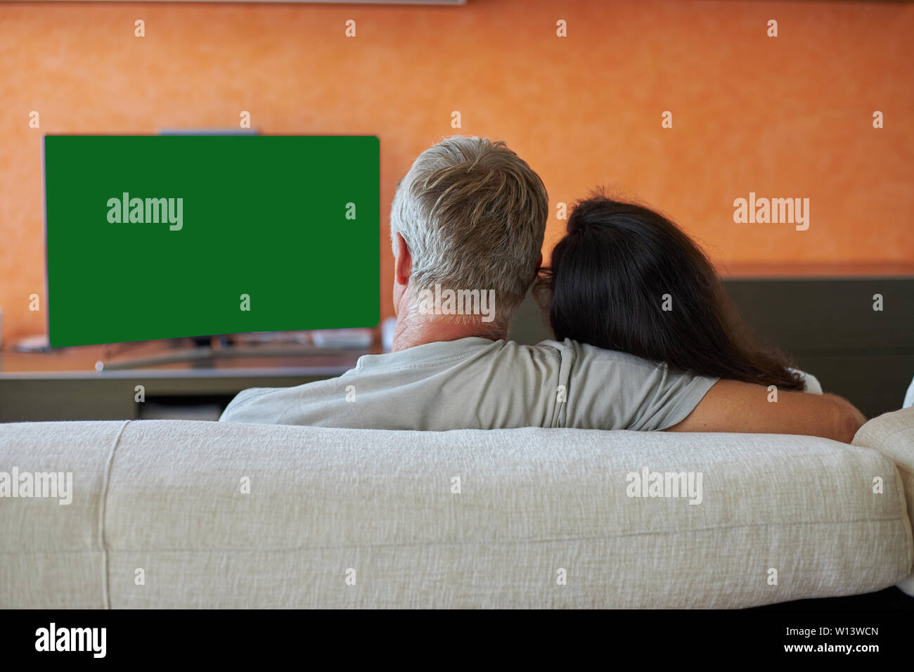 Looking at tv hi-res stock photography and images - Alamy