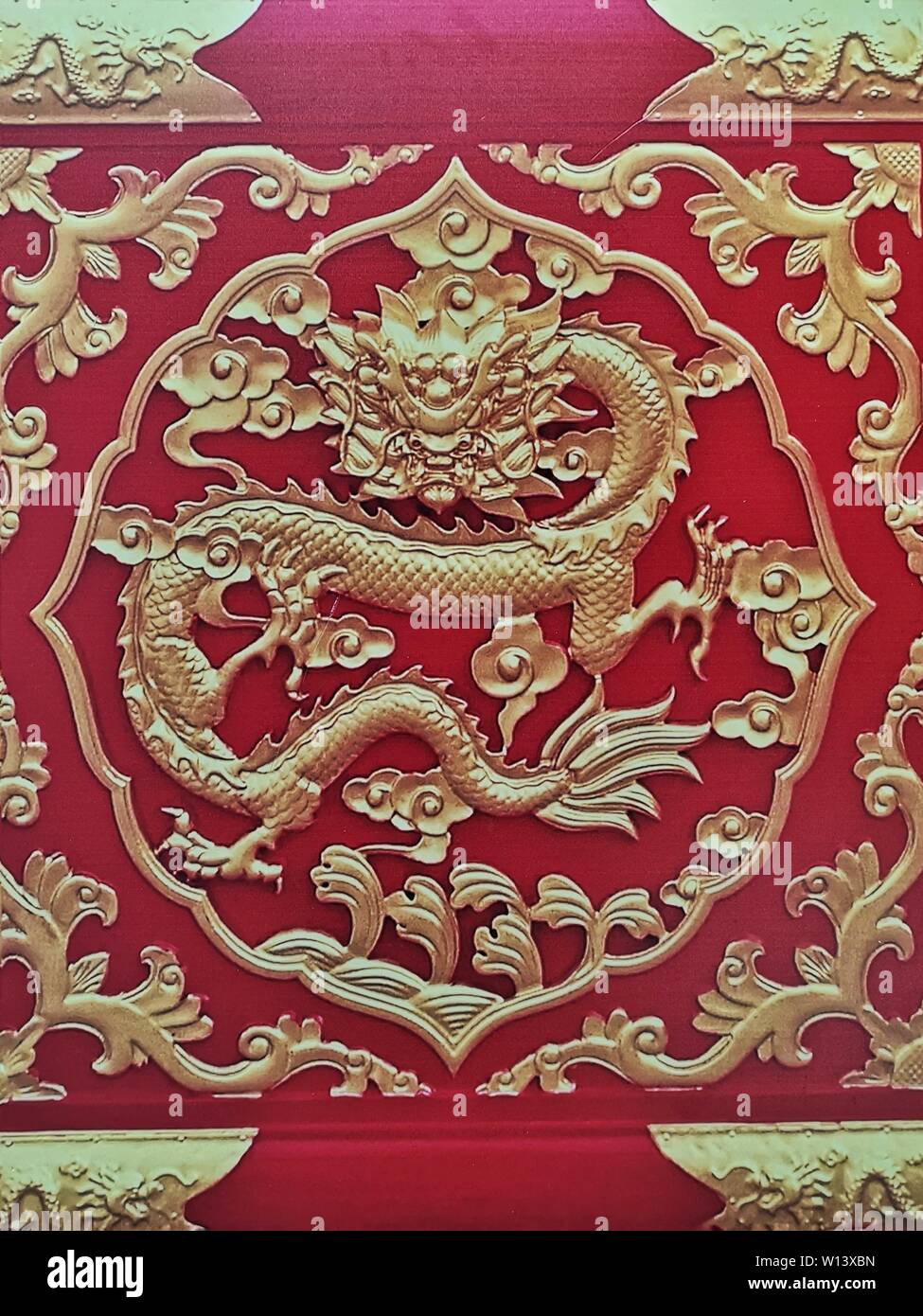 Golden dragon relief Stock Photo - Alamy