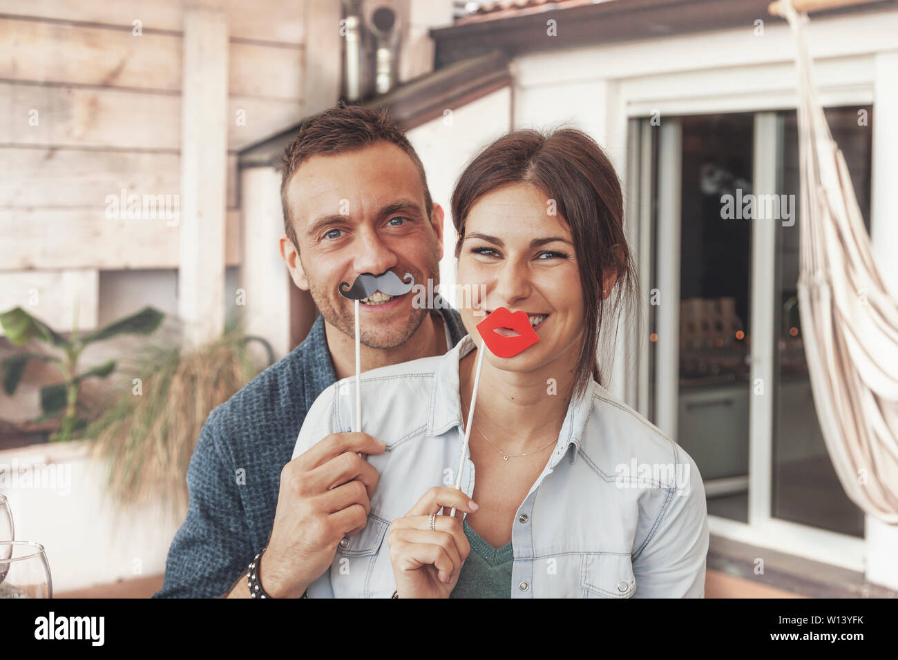 Couple of young lovers playing at the beginning of the romance on the ...