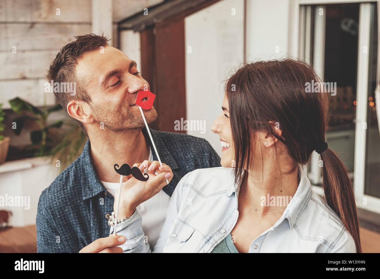 Couple of young lovers playing at the beginning of the romance on the ...