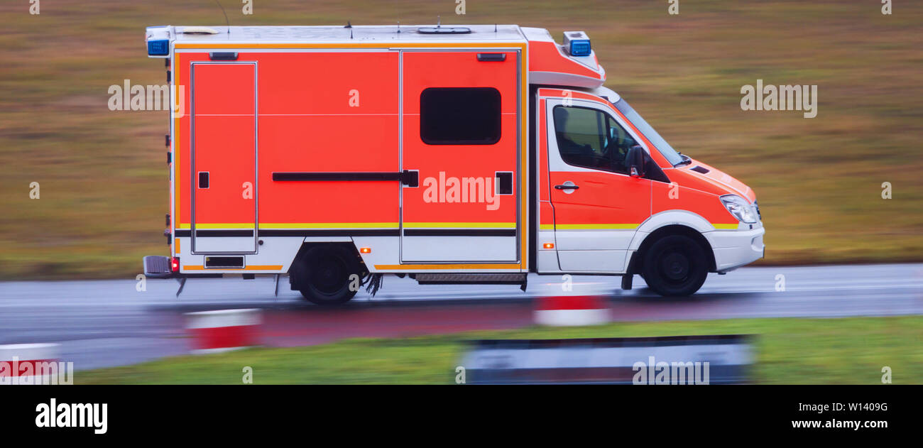 an plain ambulance car speeding by Stock Photo - Alamy