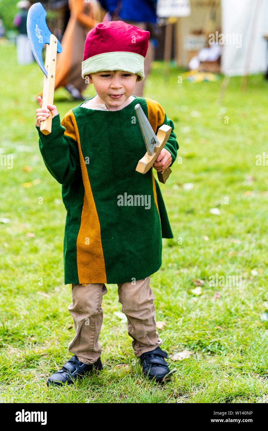 Medieval re-enactment event. Young Caucasian child, boy, 4-5 year old ...