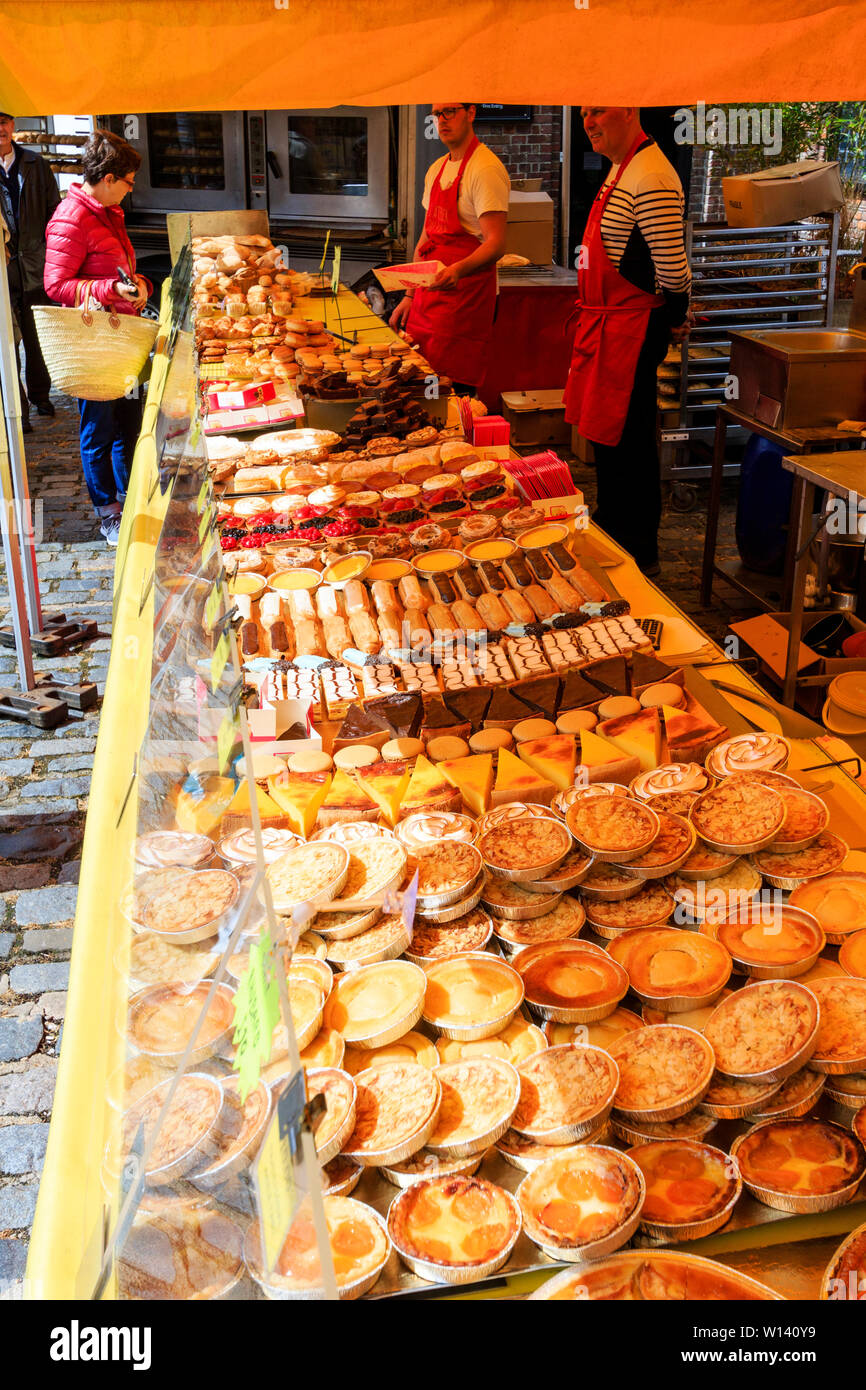 View along French bakery market stall in English cobbled town square ...