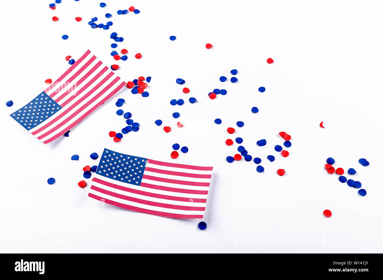american flag and confetti in national colors of america on a white ...