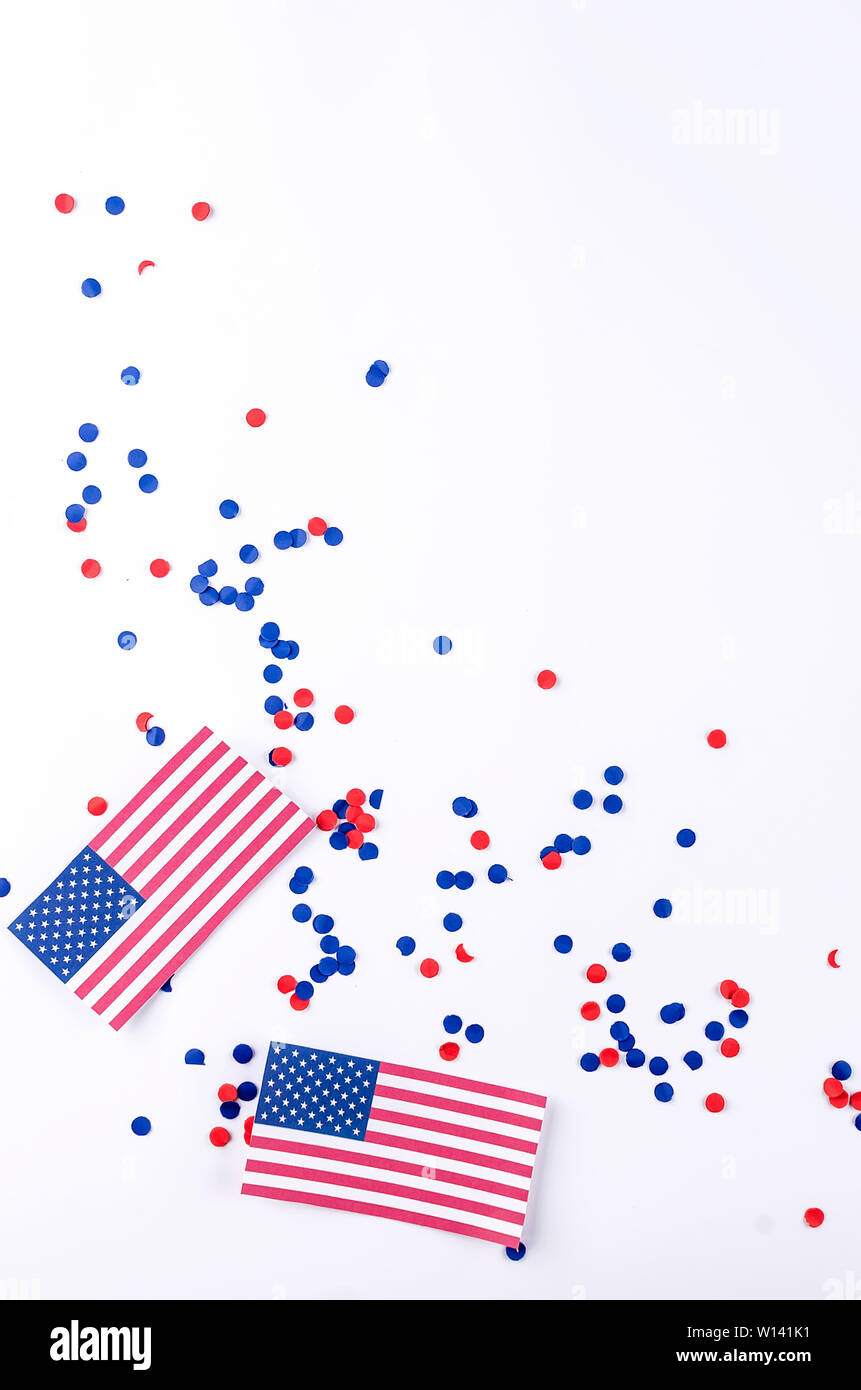 american flag and confetti in national colors of america on a white ...