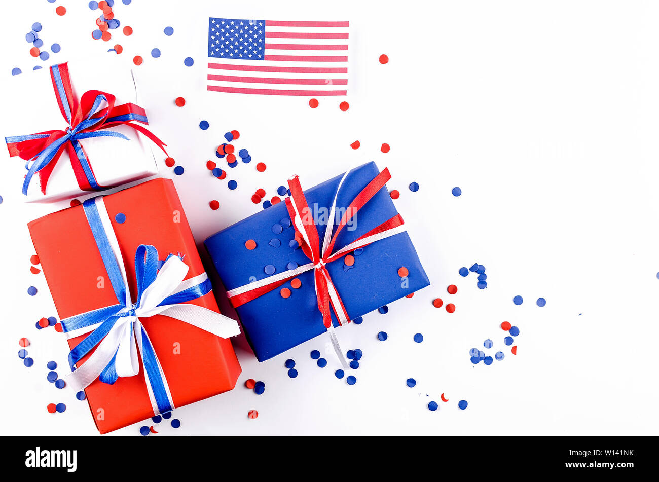 flag of america and red, blue and white gift boxes on a white ...