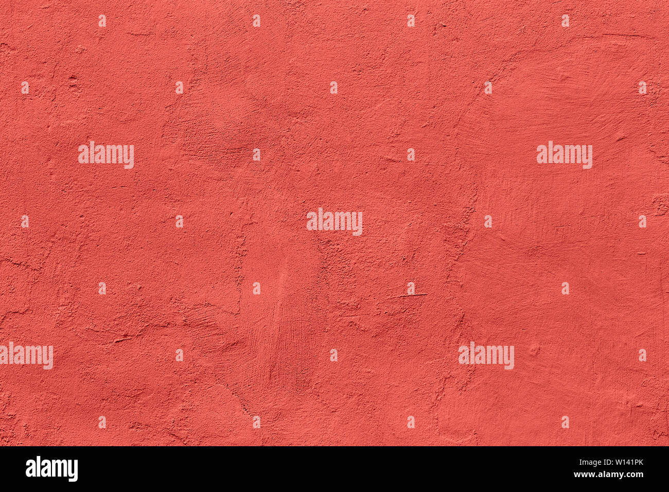 flat live coral color plaster wall matte texture Stock Photo - Alamy