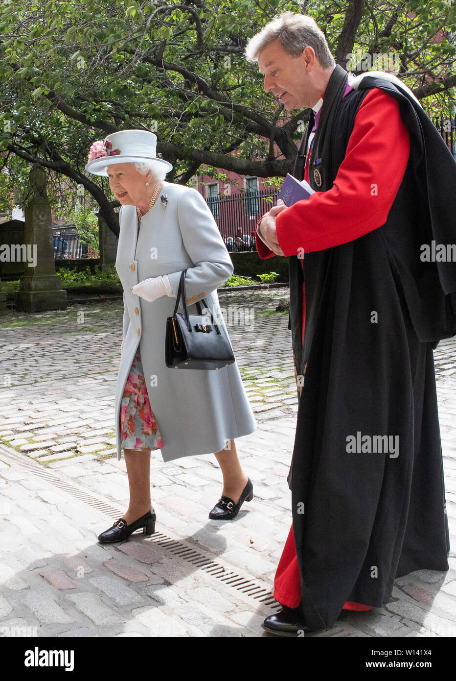 Queen Elizabeth II with the Reverend Neil Gardner as she arrives at ...