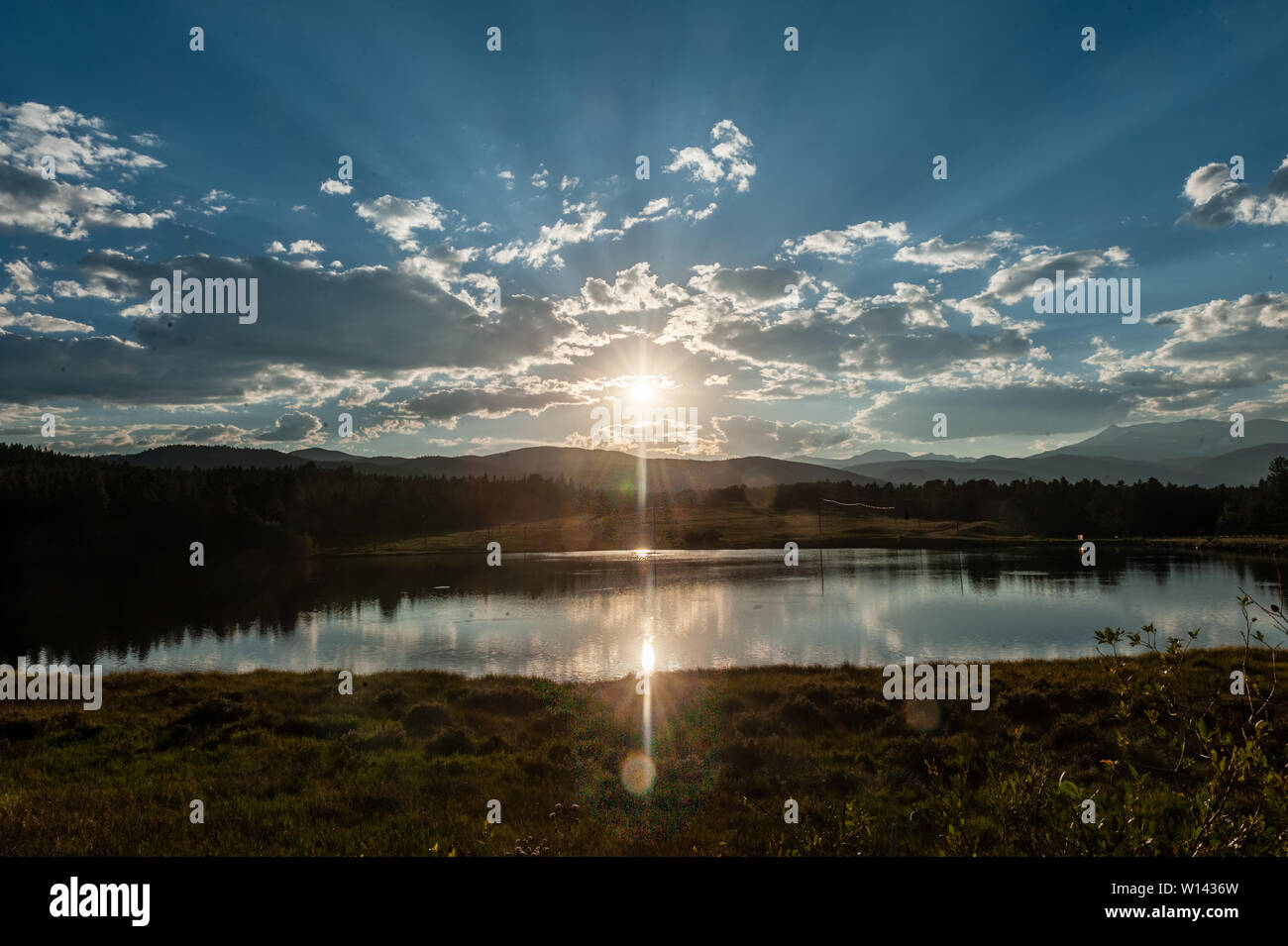 Sunset over a small Lake in the Colorado Rocky Mountains, known as Los ...