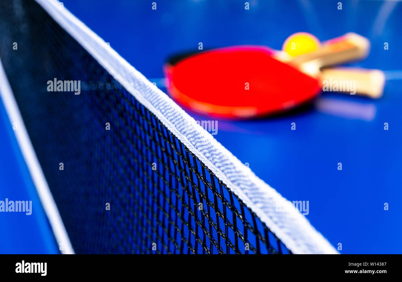 Blue table tennis or ping pong. Close-up ping-pong net. Close up ping ...