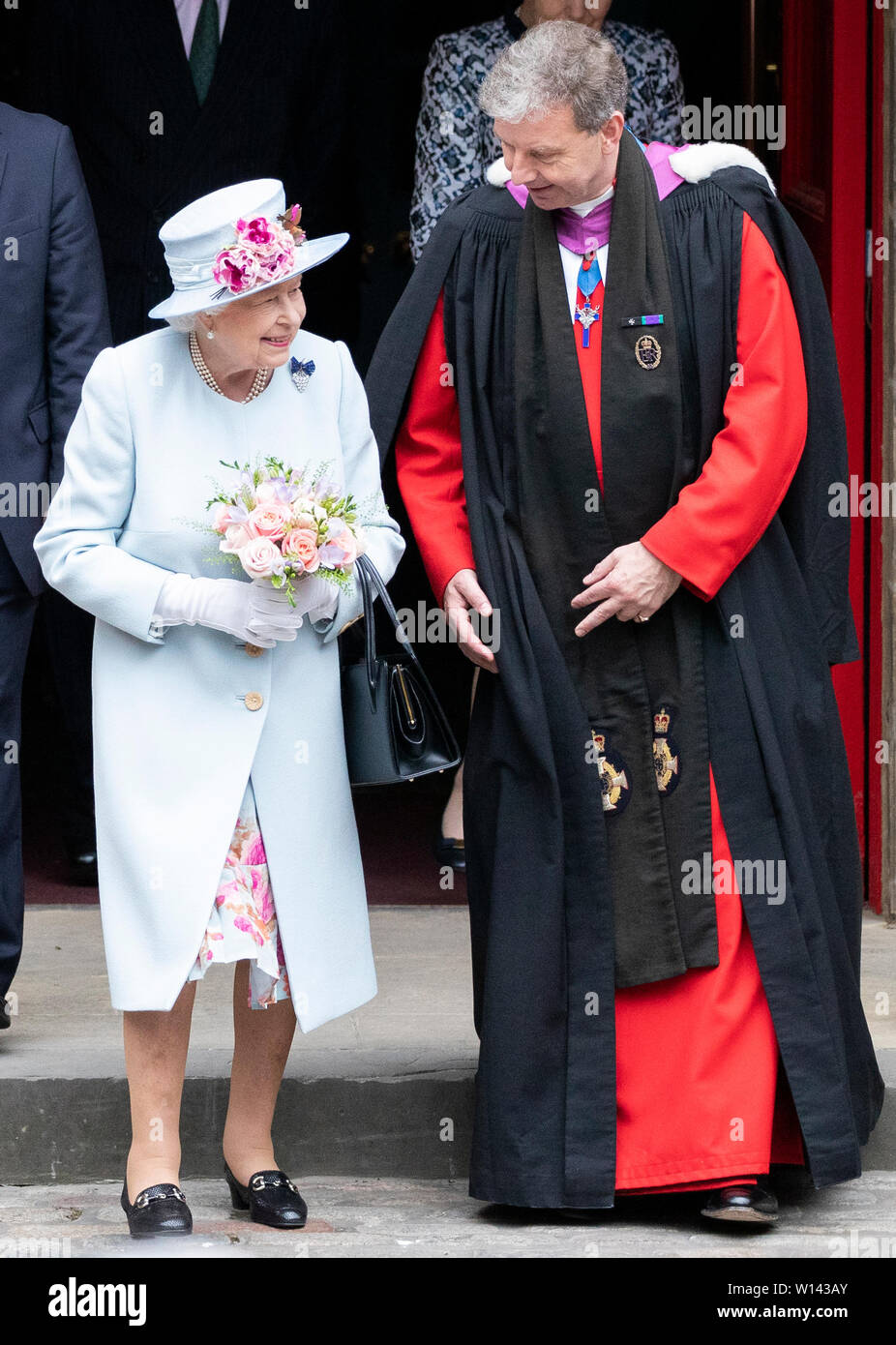 Queen Elizabeth II with Reverend Neil Gardner outside the Canongate ...