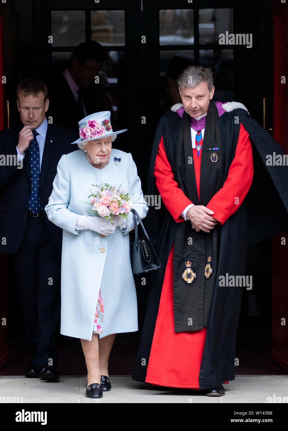 Queen Elizabeth II with Reverend Neil Gardner outside the Canongate ...