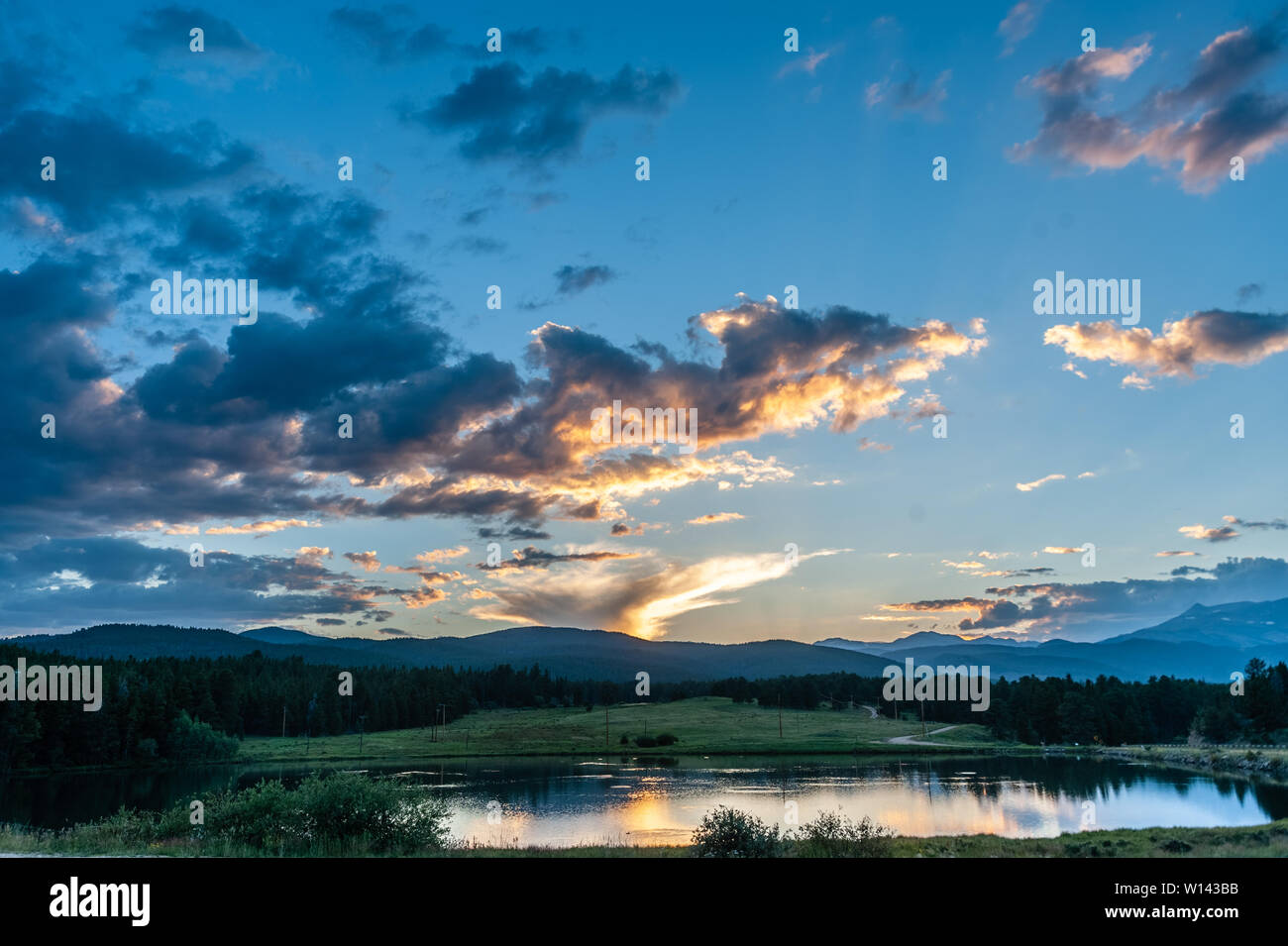 Sunset over a small Lake in the Colorado Rocky Mountains, known as Los ...