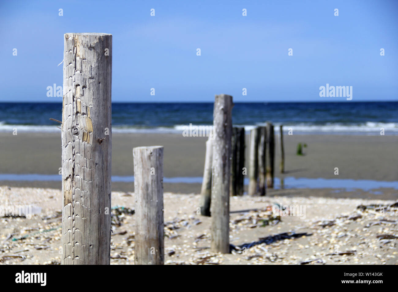 Wooden poles on sandy hi-res stock photography and images - Alamy