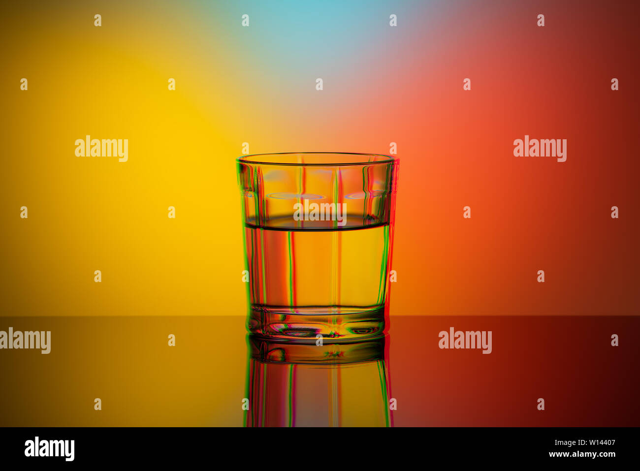 Art glitch effect, glass glass with water on bright multi-colored ...