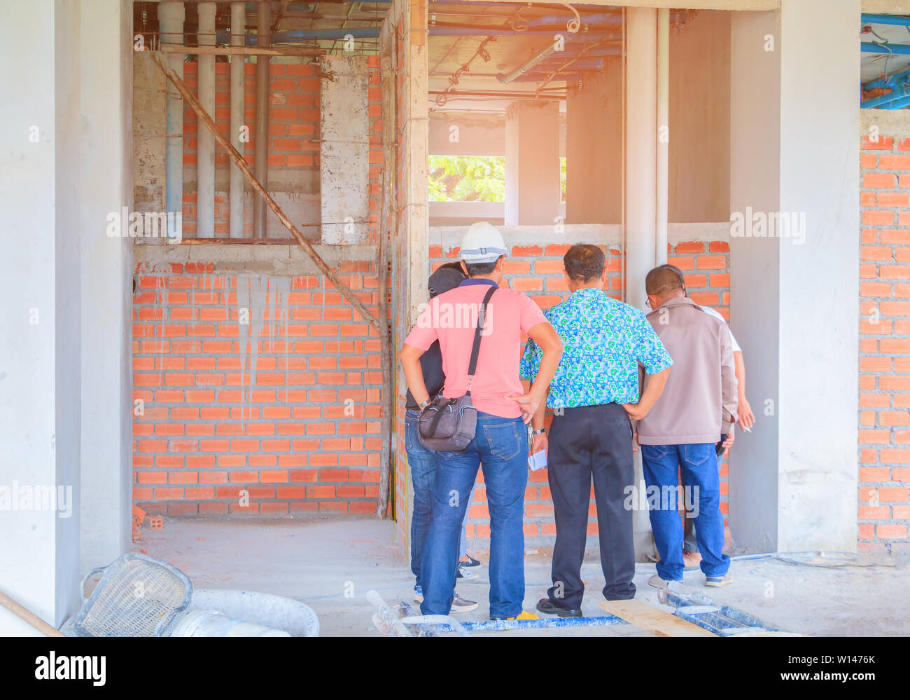construction site and engineer check build plan development on housing ...