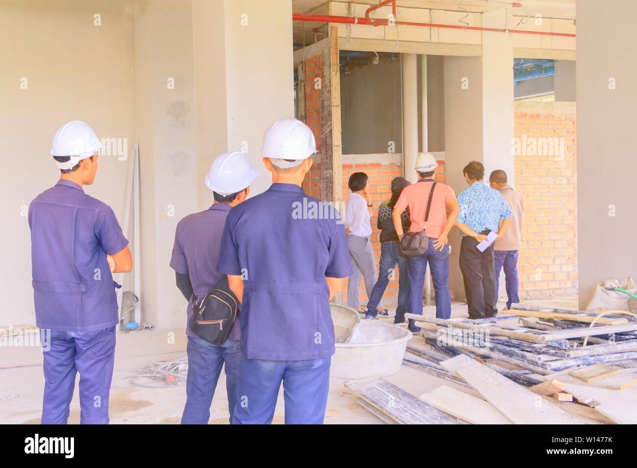 construction site and engineer check build plan development on housing ...