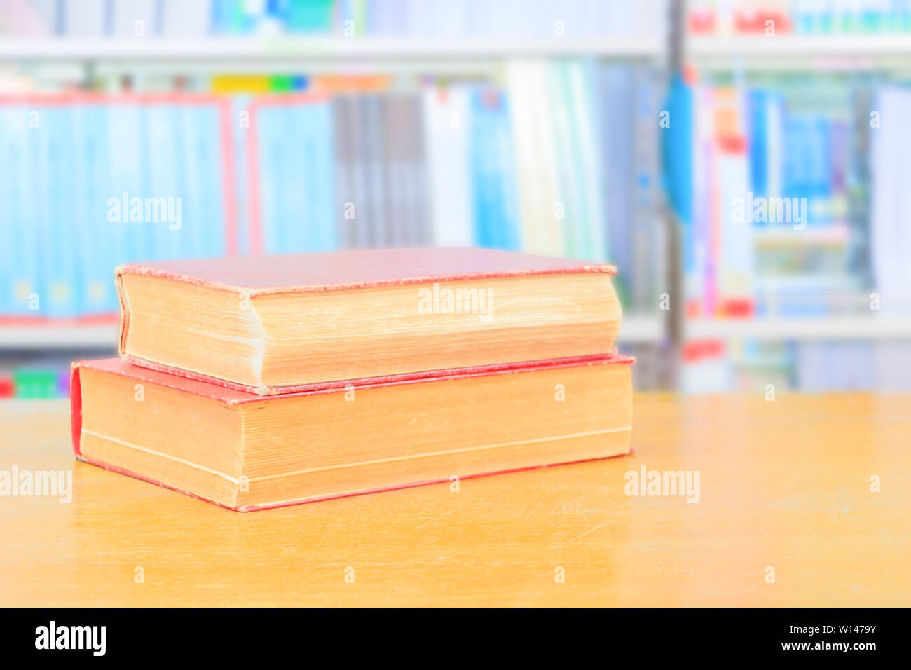 old book red and heap treatise in school library on wooden table ...