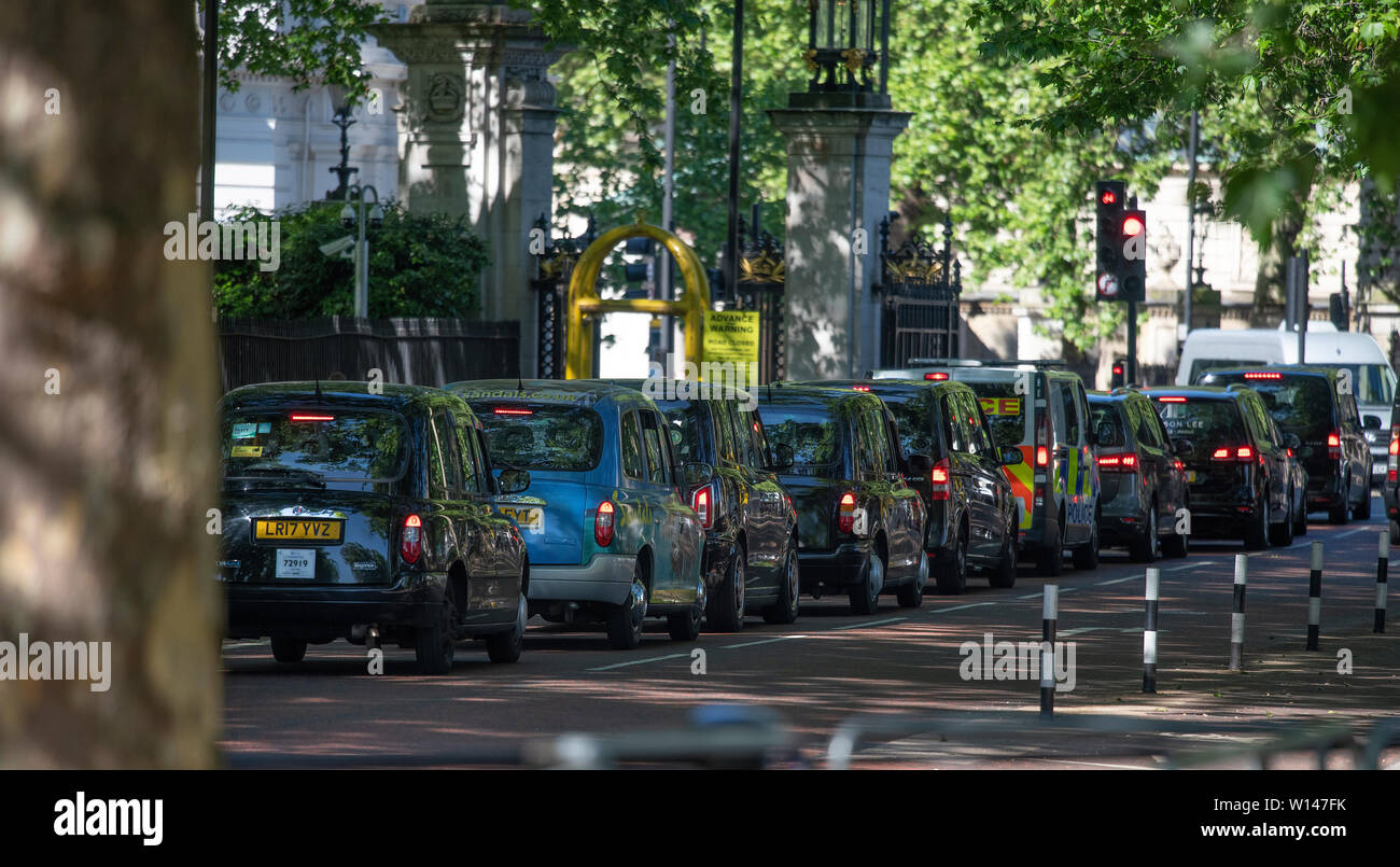 Long line of taxis at the western end of Birdcage Walk in central ...