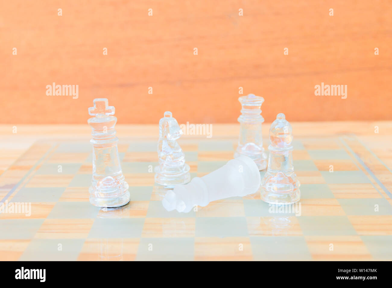 chess glass on board game. On a vintage wooden floor background Concept ...