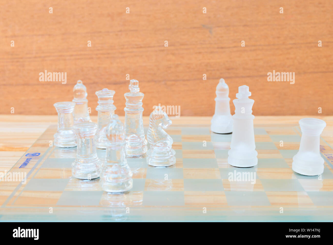 chess glass on board game. On a vintage wooden floor background Concept ...