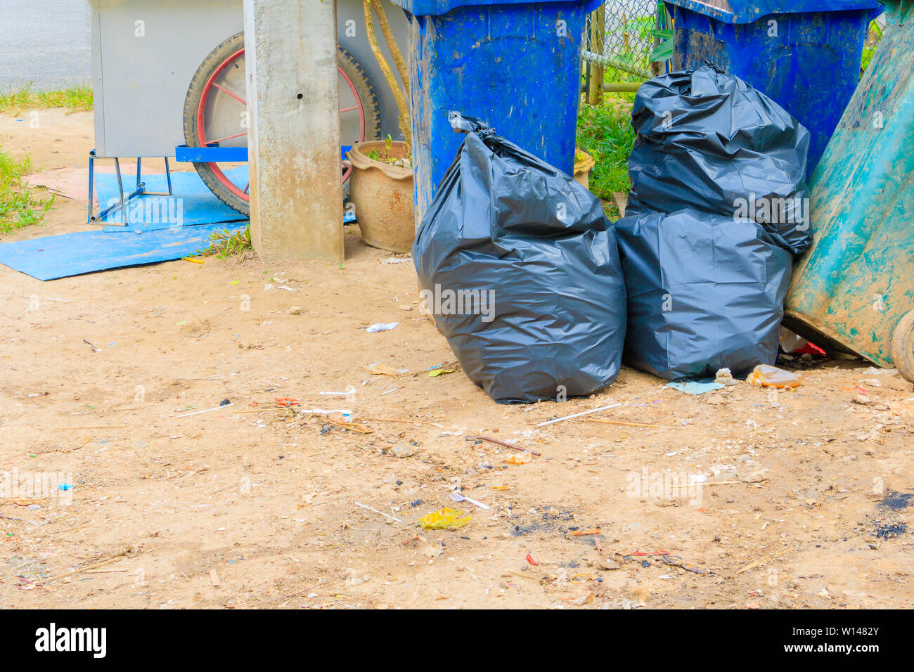 pile black garbage bag plastic and four dustbin dirty roadside in the ...