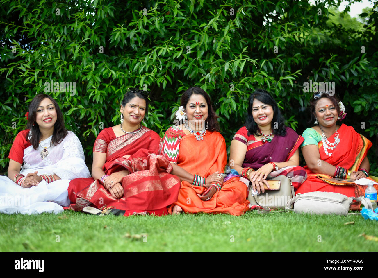 London, UK. 30 June 2019. Women wearing saris pose for a photo during ...