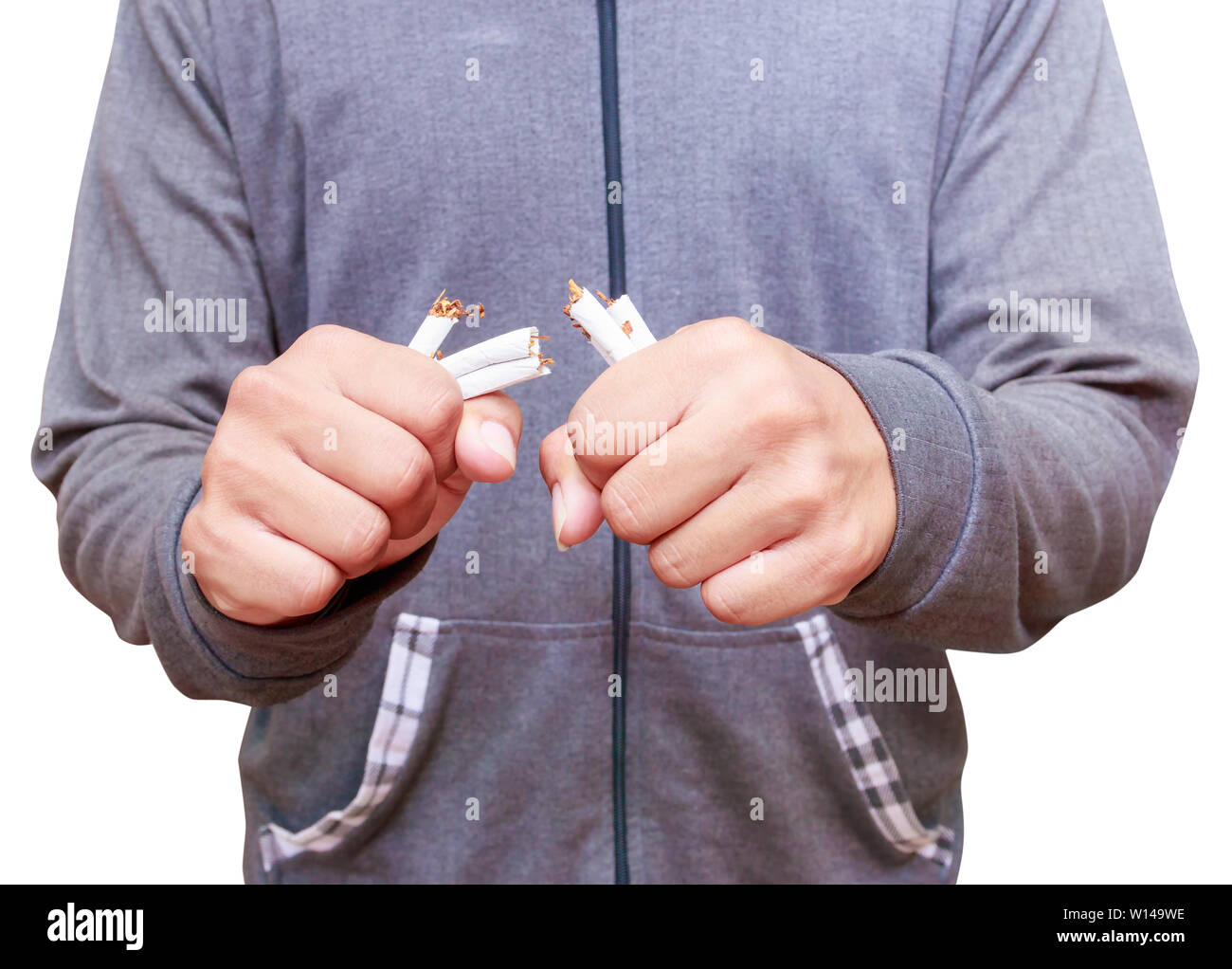 male young holding broken cigarette in hands. health care concept stop ...