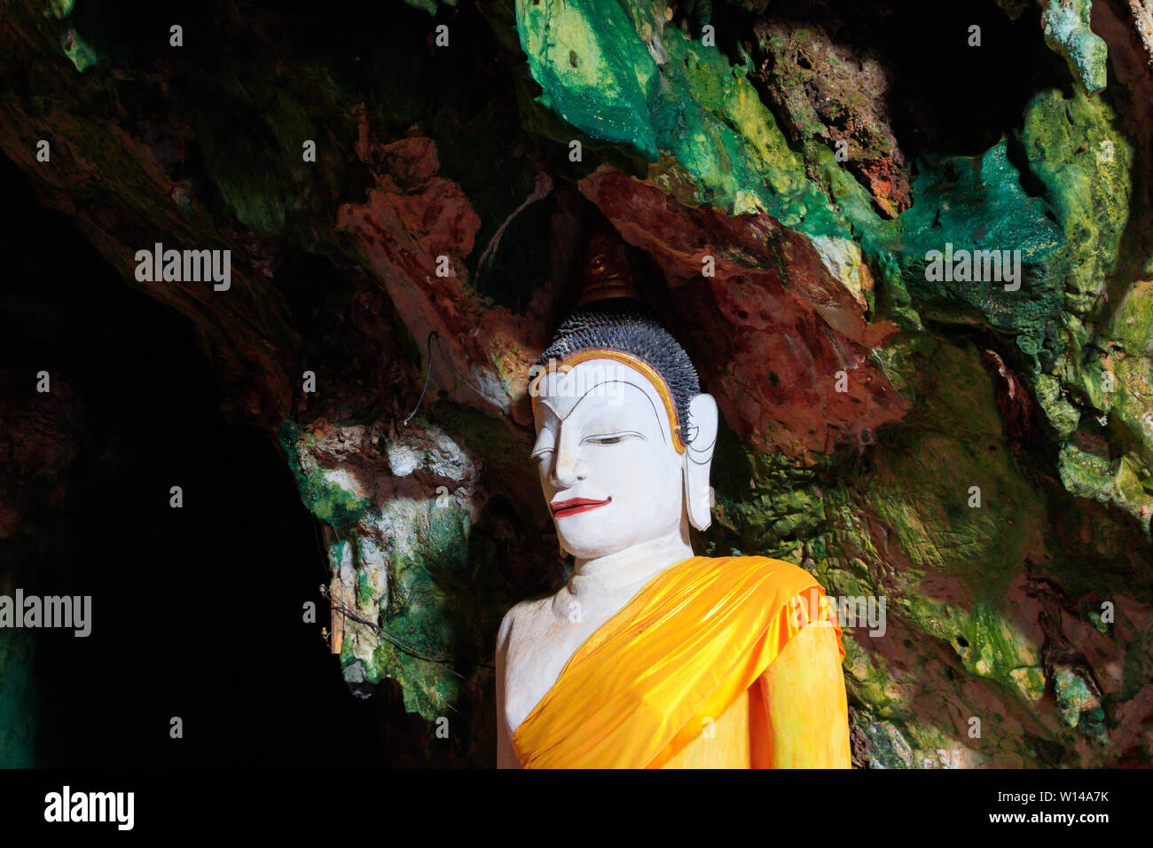 Buddha statues ancient in cave Stock Photo - Alamy