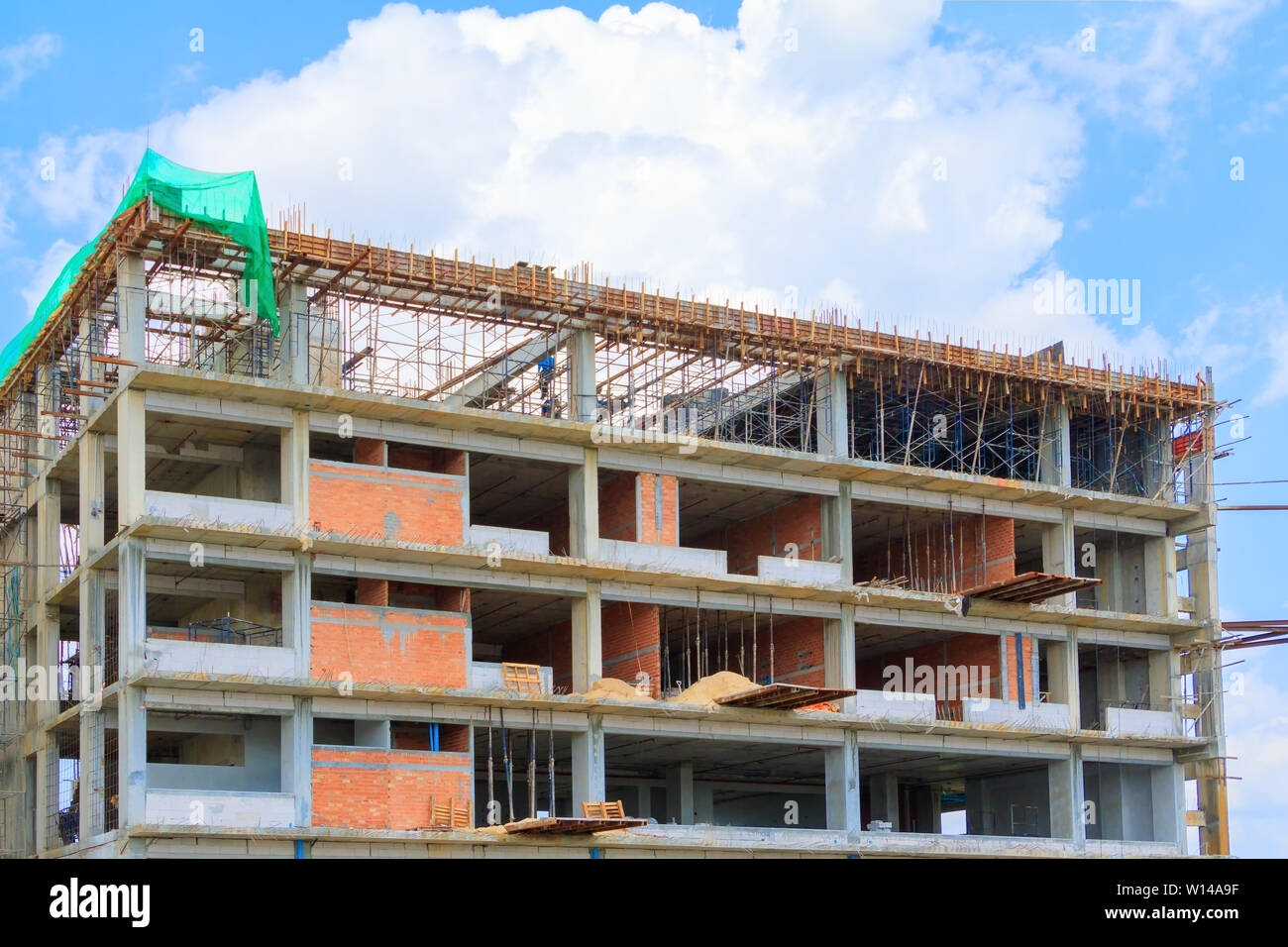 high big construction site in develop city and tower crane working ...