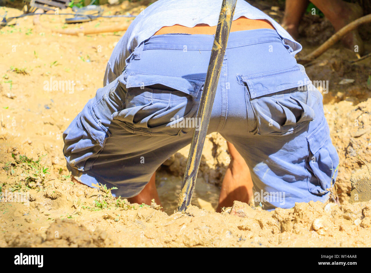 male plumber are repair broken pipe in hole with plumbing water flow ...