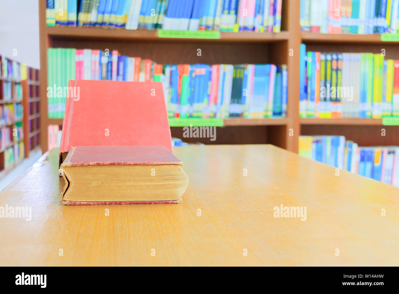 old book red and heap treatise in school library on wooden table ...