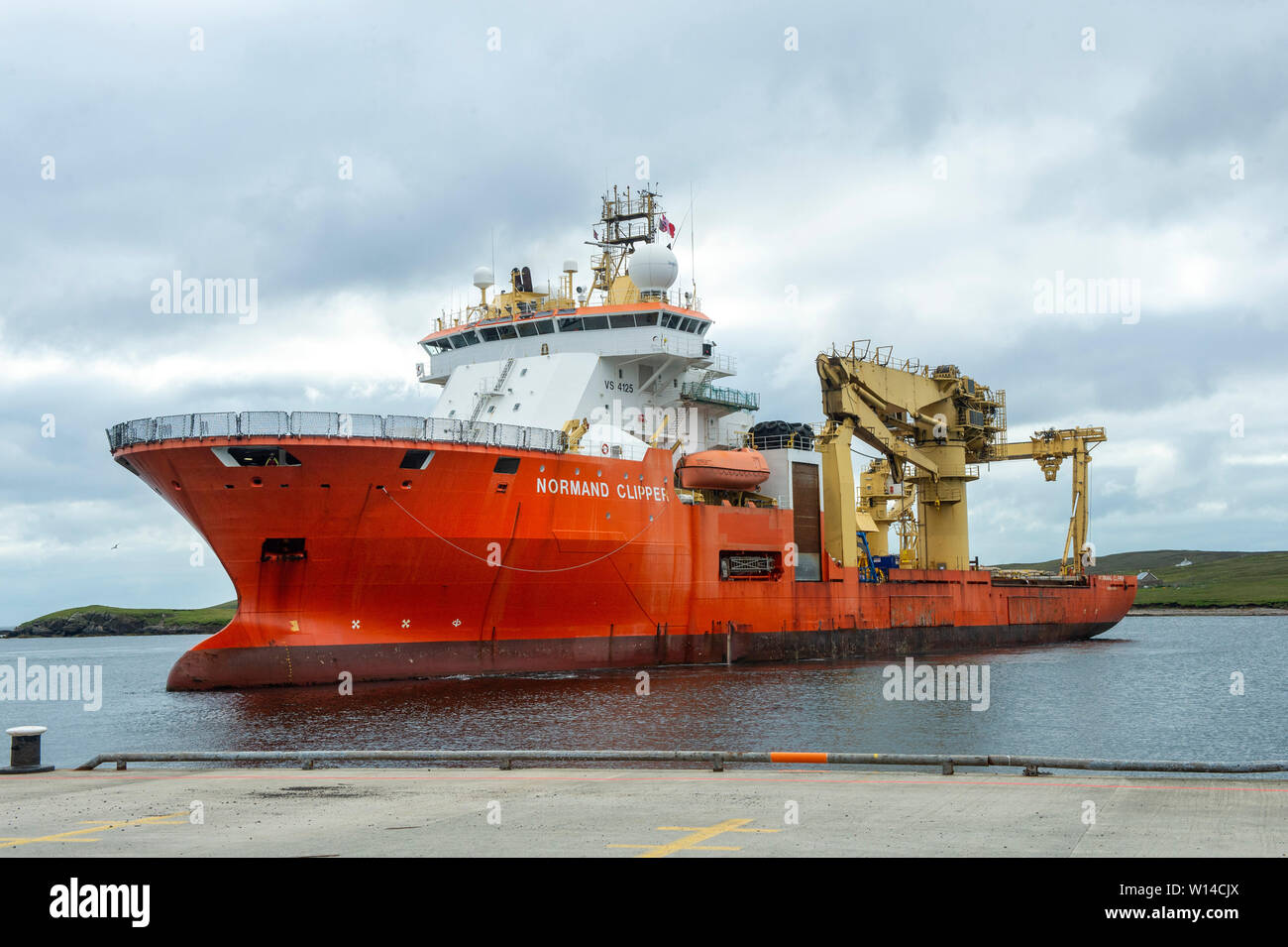 Normand Clipper berthing and putting ashore decommissioned oil rig ...