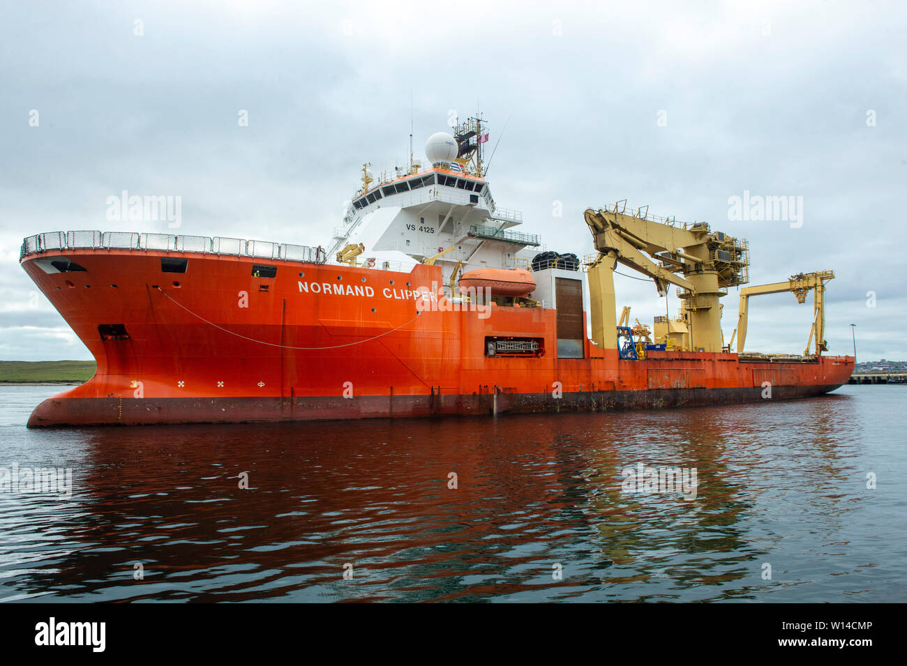 Normand Clipper berthing and putting ashore decommissioned oil rig ...