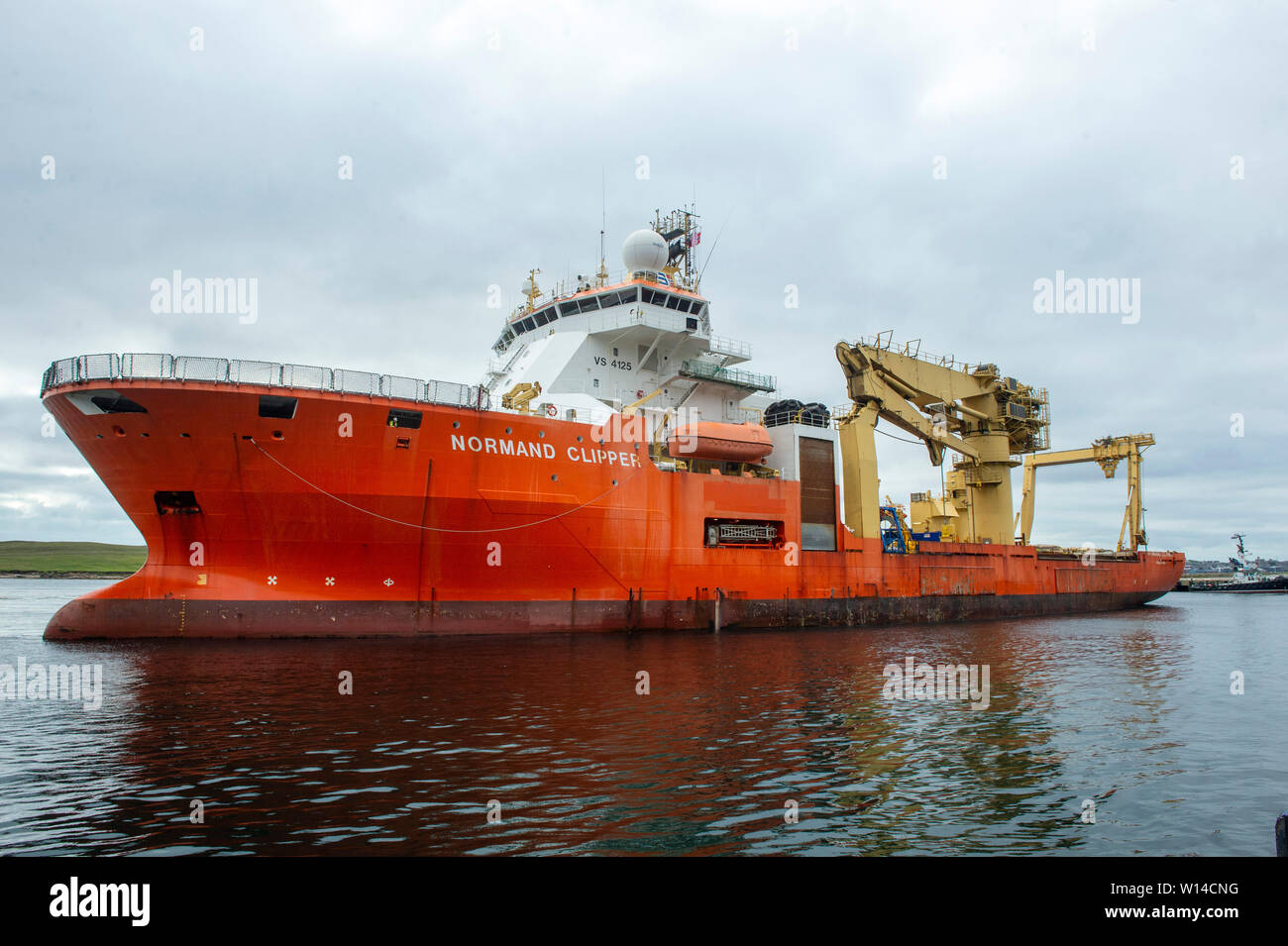 Normand Clipper berthing and putting ashore decommissioned oil rig ...
