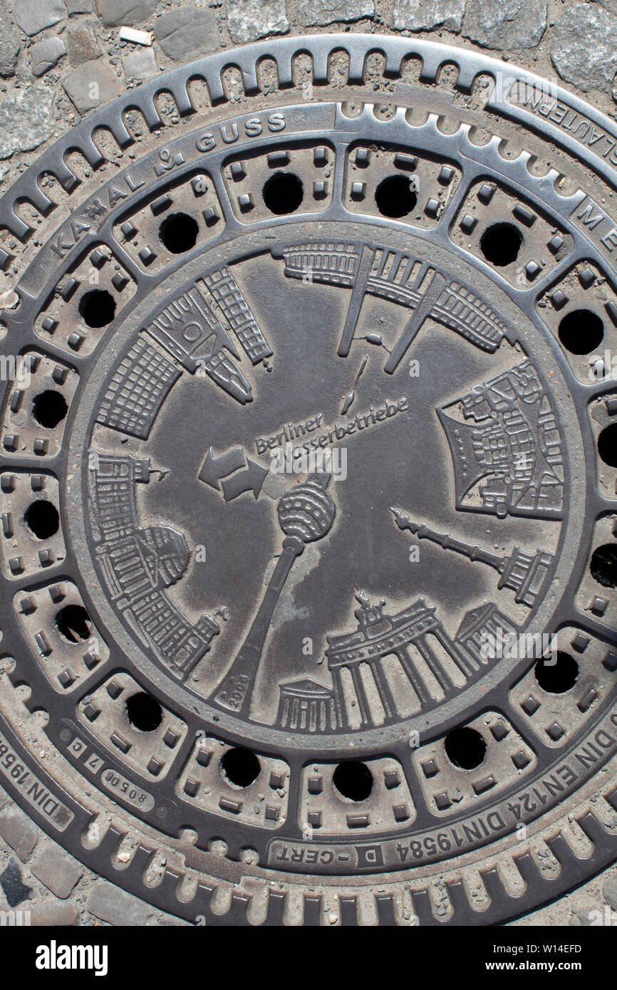 A manhole cover displaying a compilation of main sights in Berlin ...