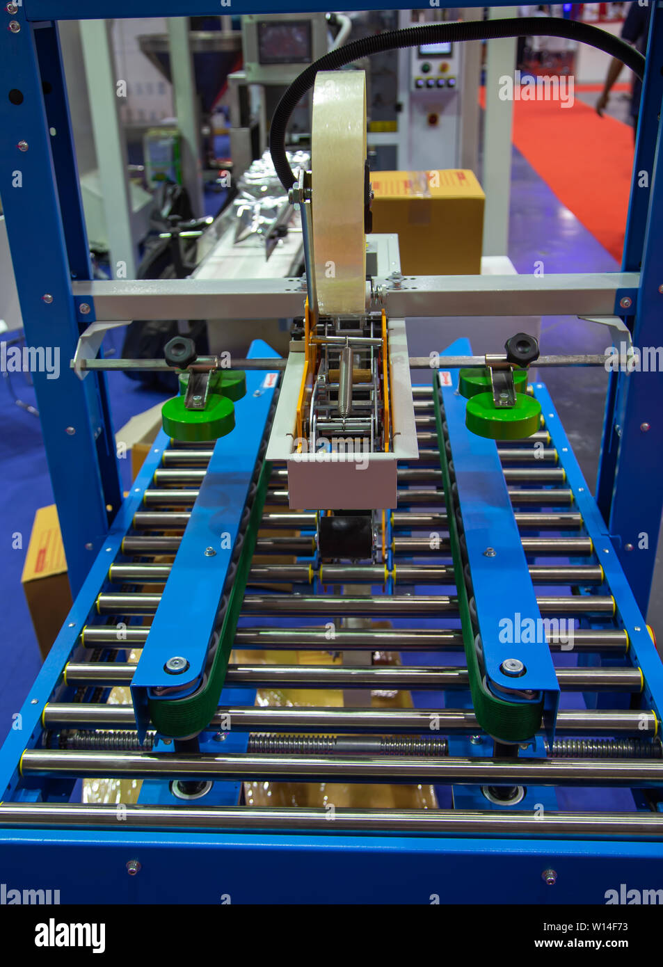 Semi automatic cardboard box tape sealing machine Stock Photo - Alamy
