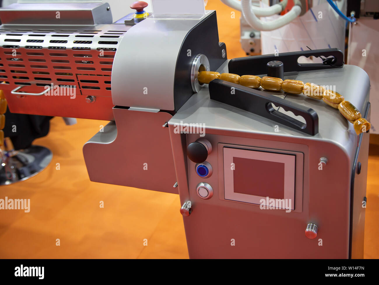 Automatic high speed sausage string tyer divider machine Stock Photo ...