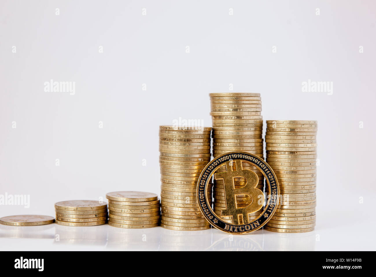 Histograma of coins and bitcoin on the white background. Concept of ...