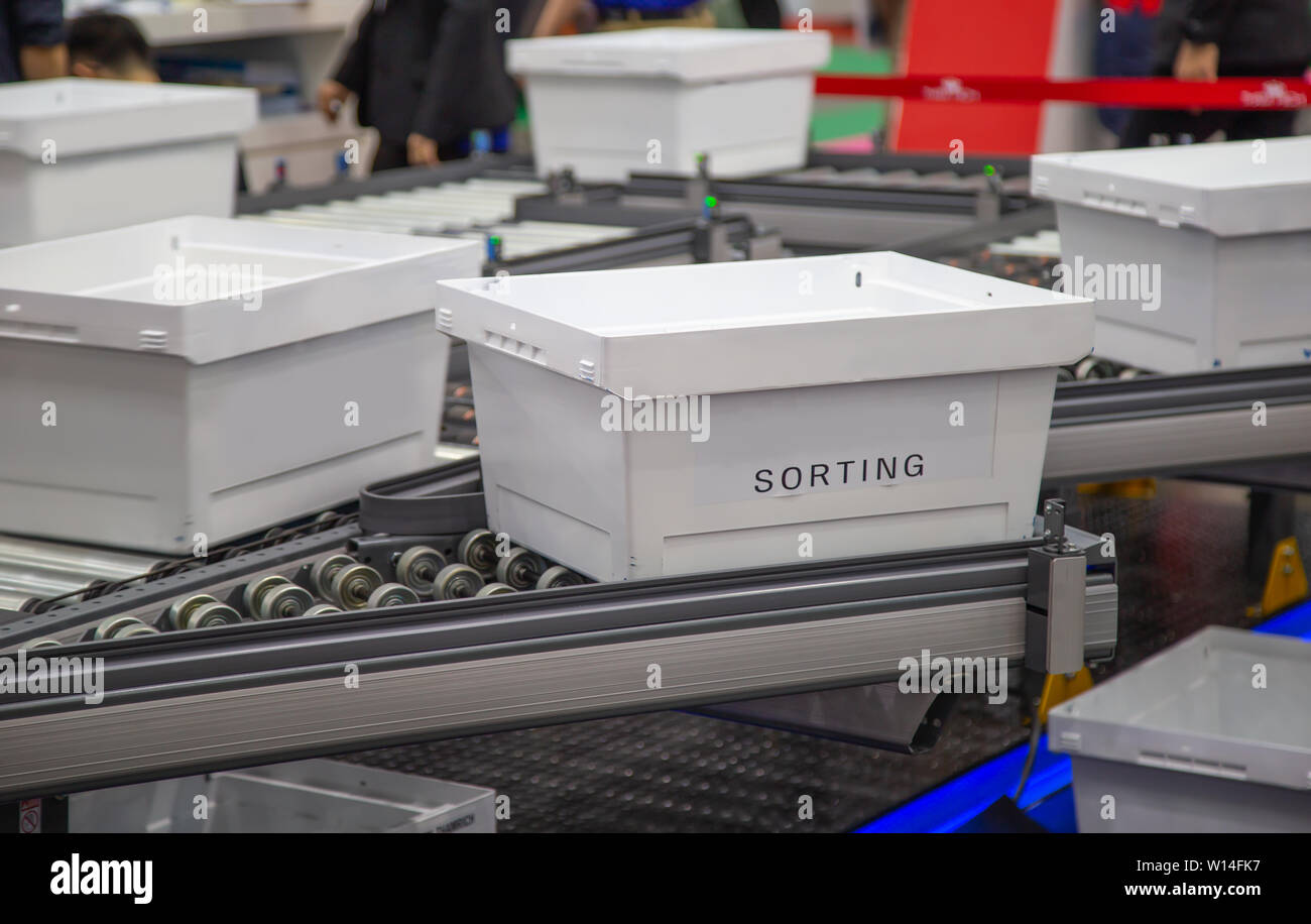 Automatic sorting system of plastic tray in production line Stock Photo ...