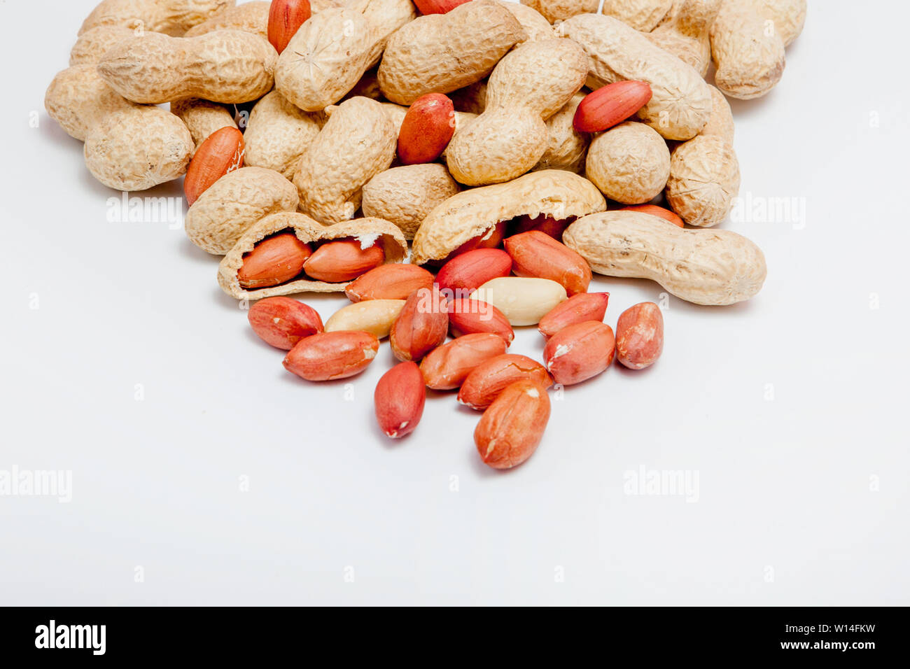 Large peeled peanuts close-up of beans in the shell. Unpeeled peanuts ...
