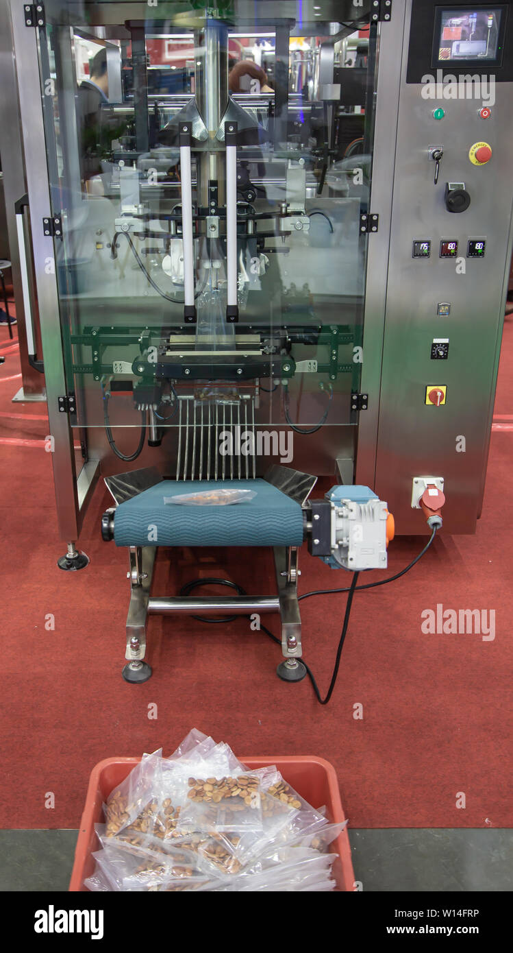 Nuts packing by vertical sealing and packing machine packing Stock ...