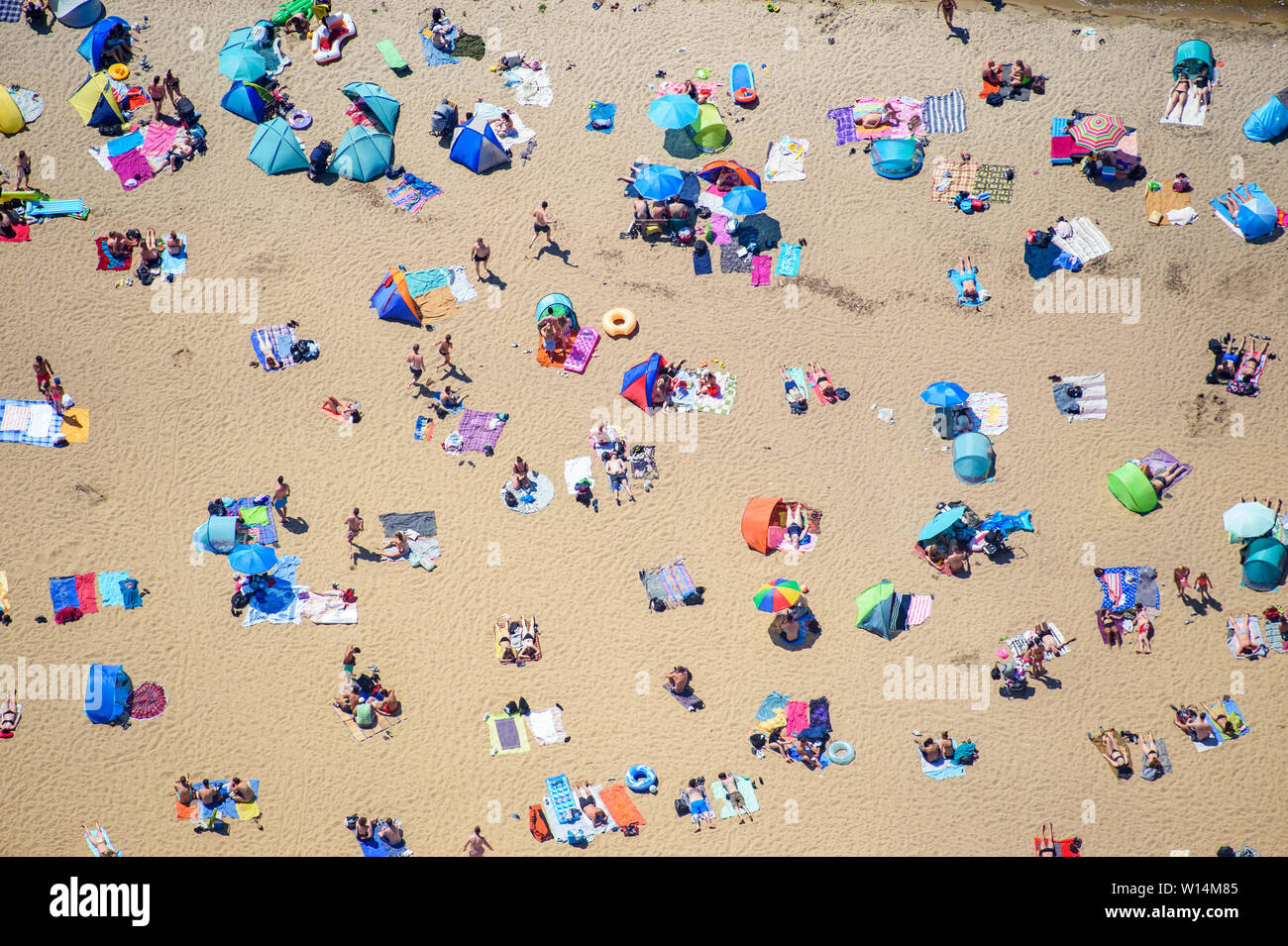 Berlin, Germany. 30th June, 2019. People sunbathe at the sandy beach of ...