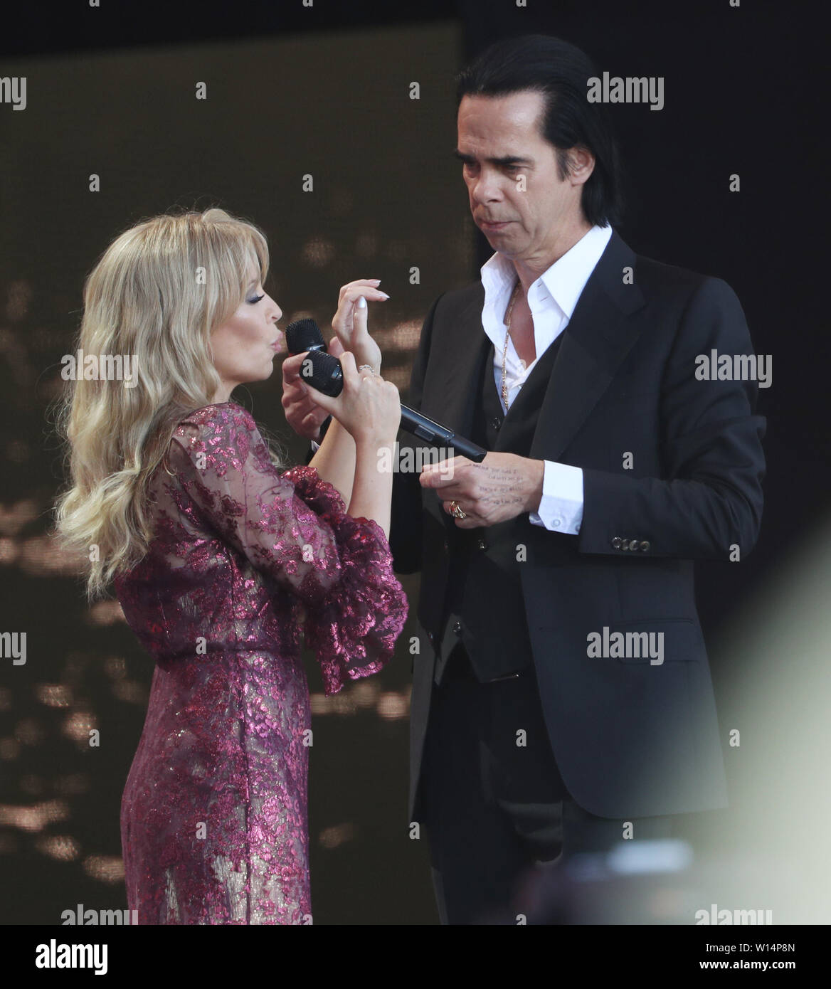 Kylie Minogue with guest Nick Cave performing on the Pyramid Stage on ...