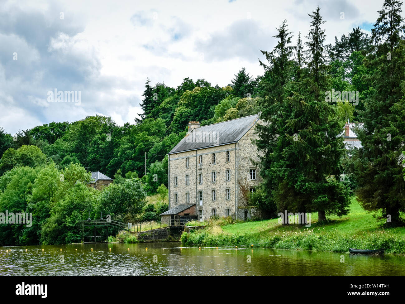 House and forest in the riverside. Green and nature landscape Stock ...